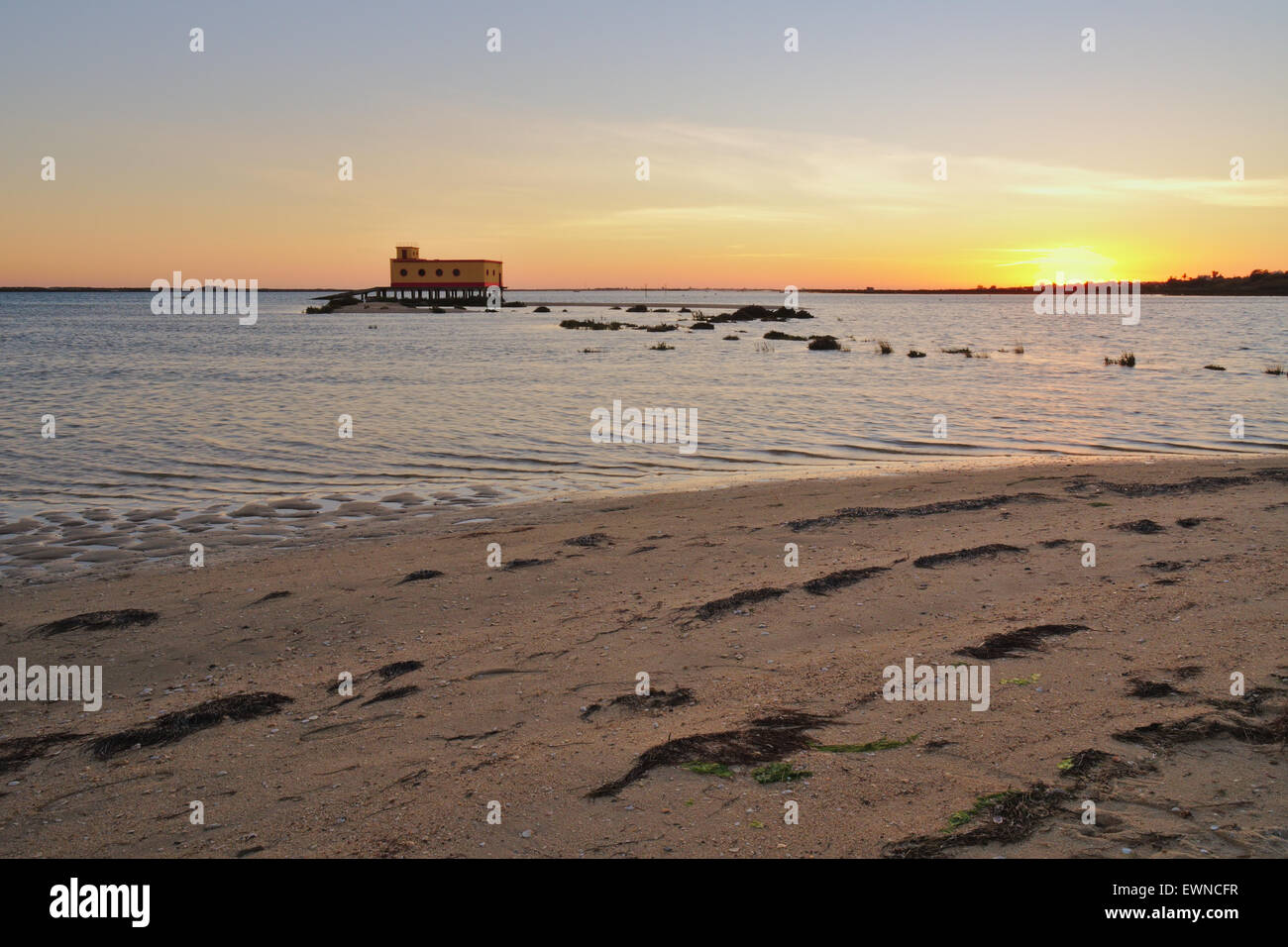 Fuzeta beach at the end of the day with old lifesaver's building ...