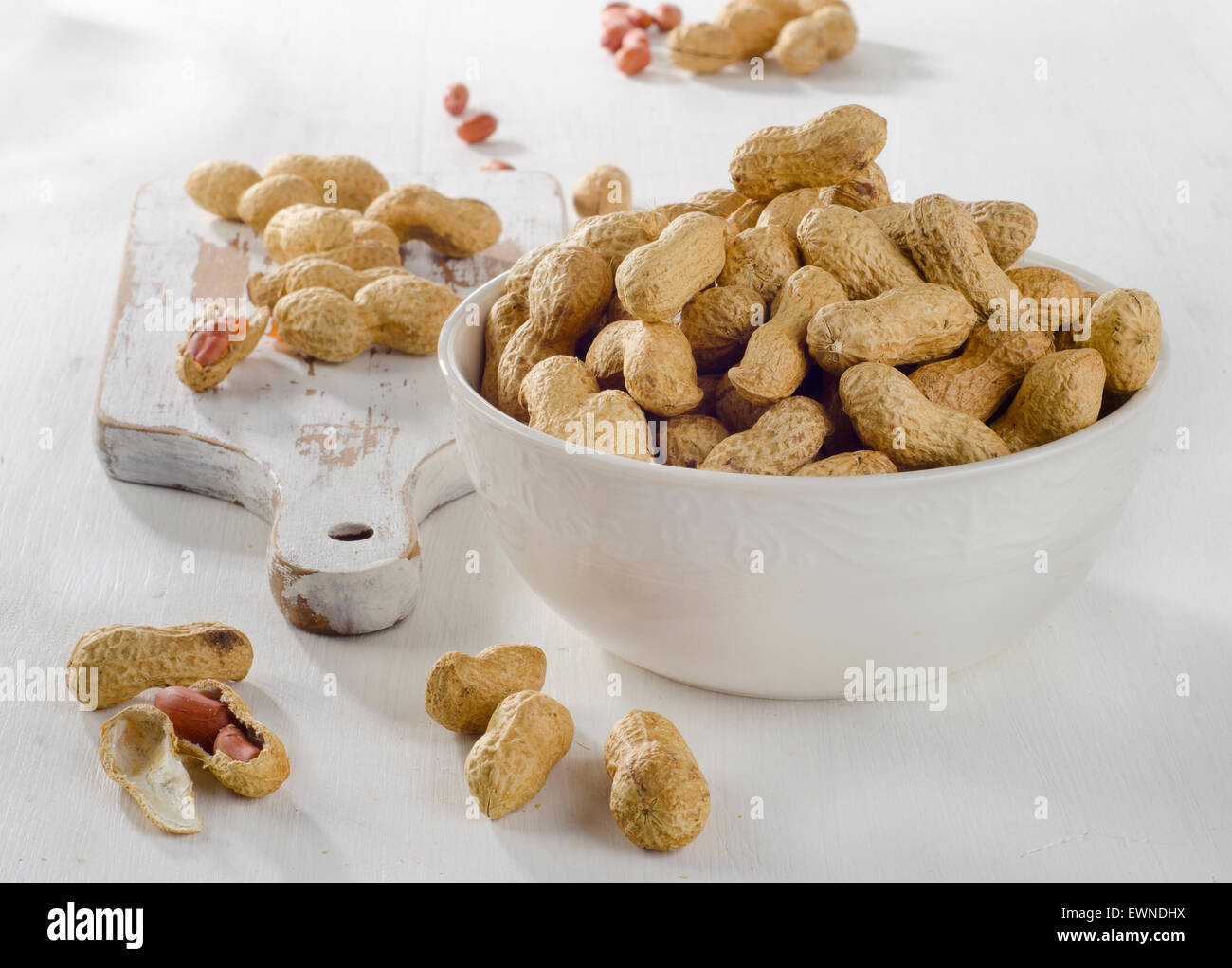 Peanuts in shells in a bowl. Selective focus Stock Photo - Alamy