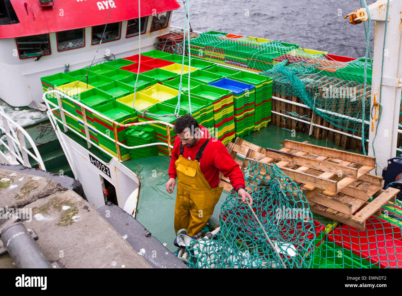 A fishing trawler putting to sea from Ullapool, Scotland, UK Stock ...