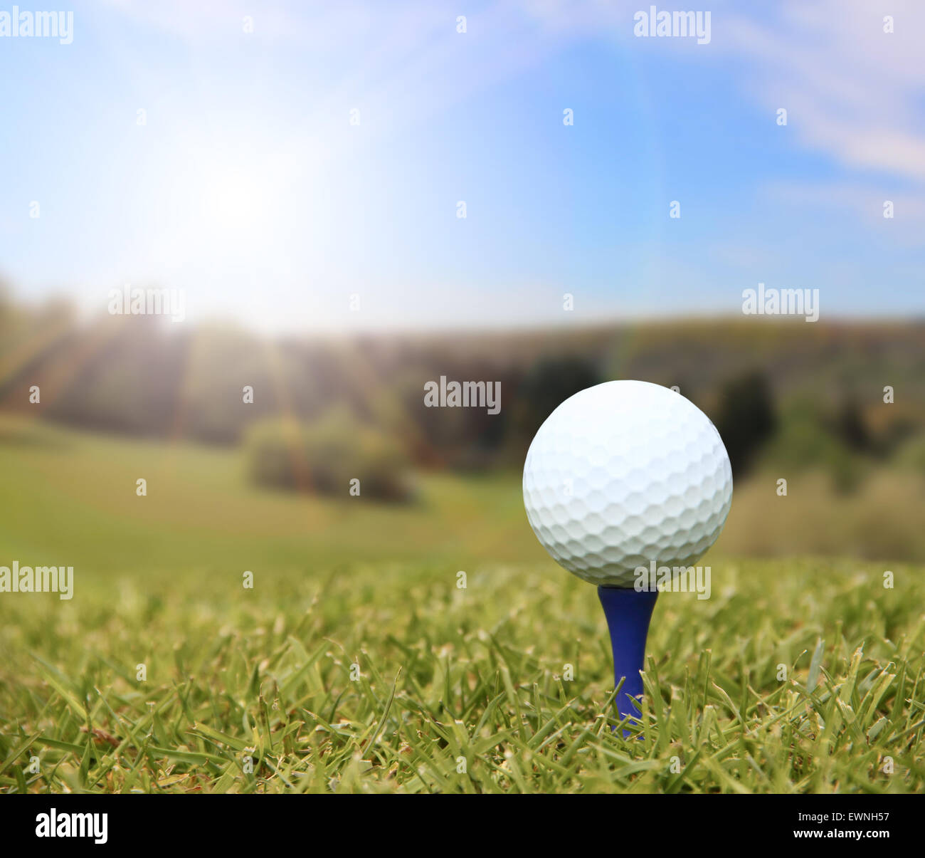 Golf ball on course with beautiful blurry landscape on background Stock ...