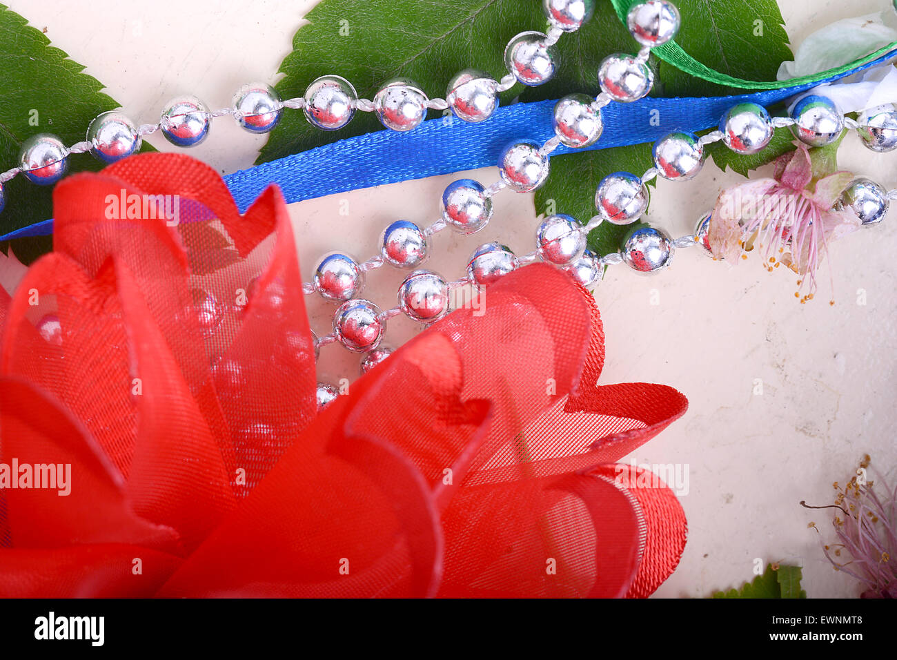 Office table with ribbons, flowers, pencils and pearls Stock Photo - Alamy