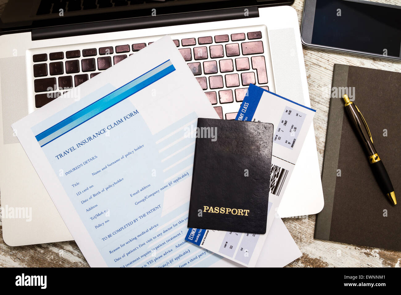 Travel insurance application form with a boarding pass and a passport ...