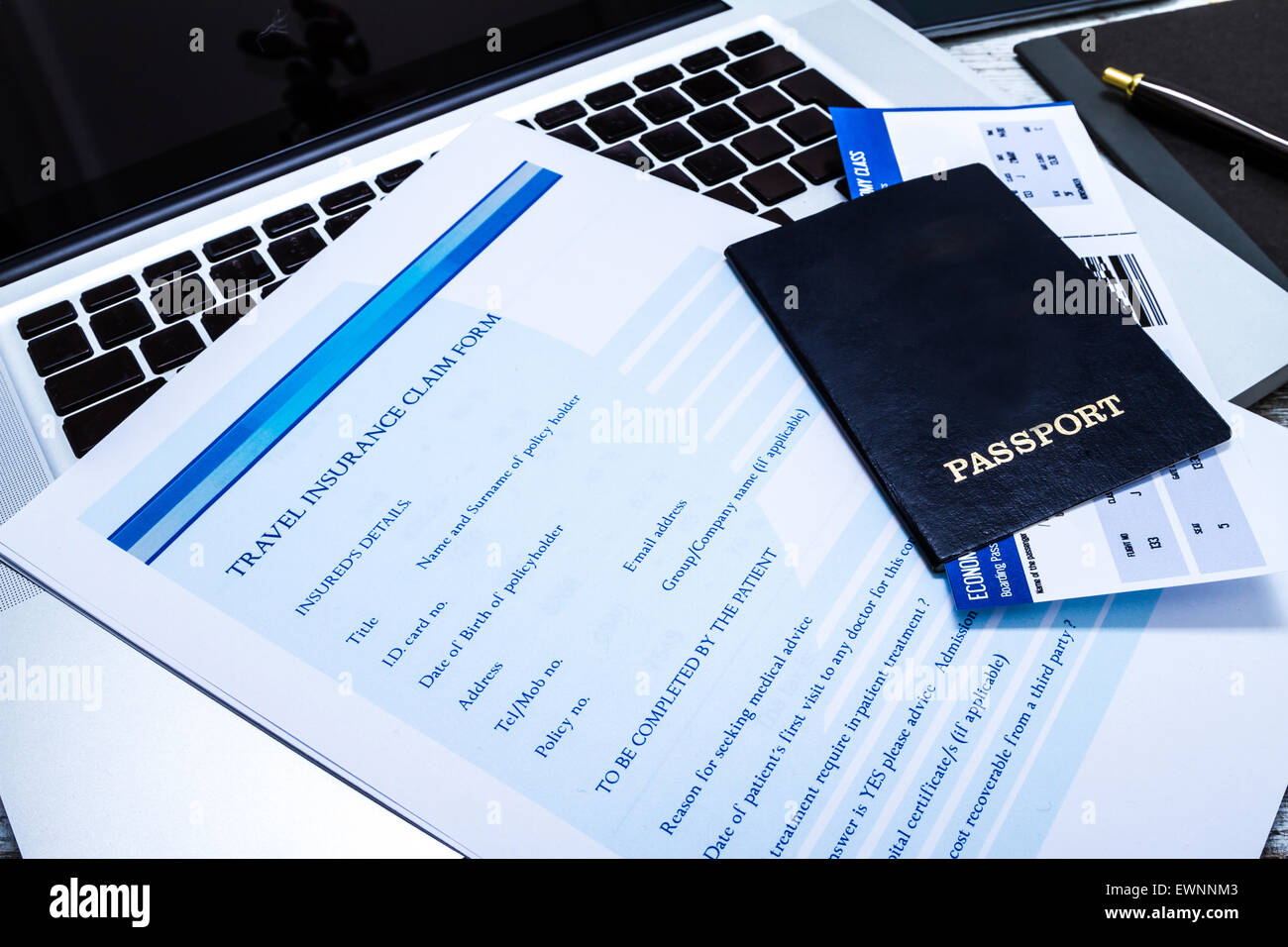 Travel insurance application form with a boarding pass and a passport ...