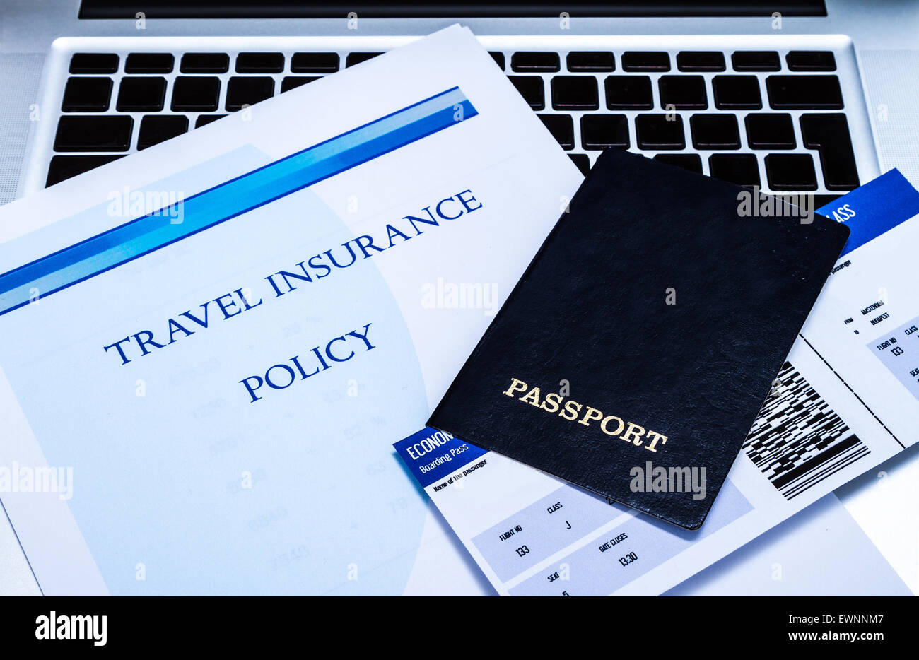 Travel insurance policy booklet with a boarding pass and a passport ...