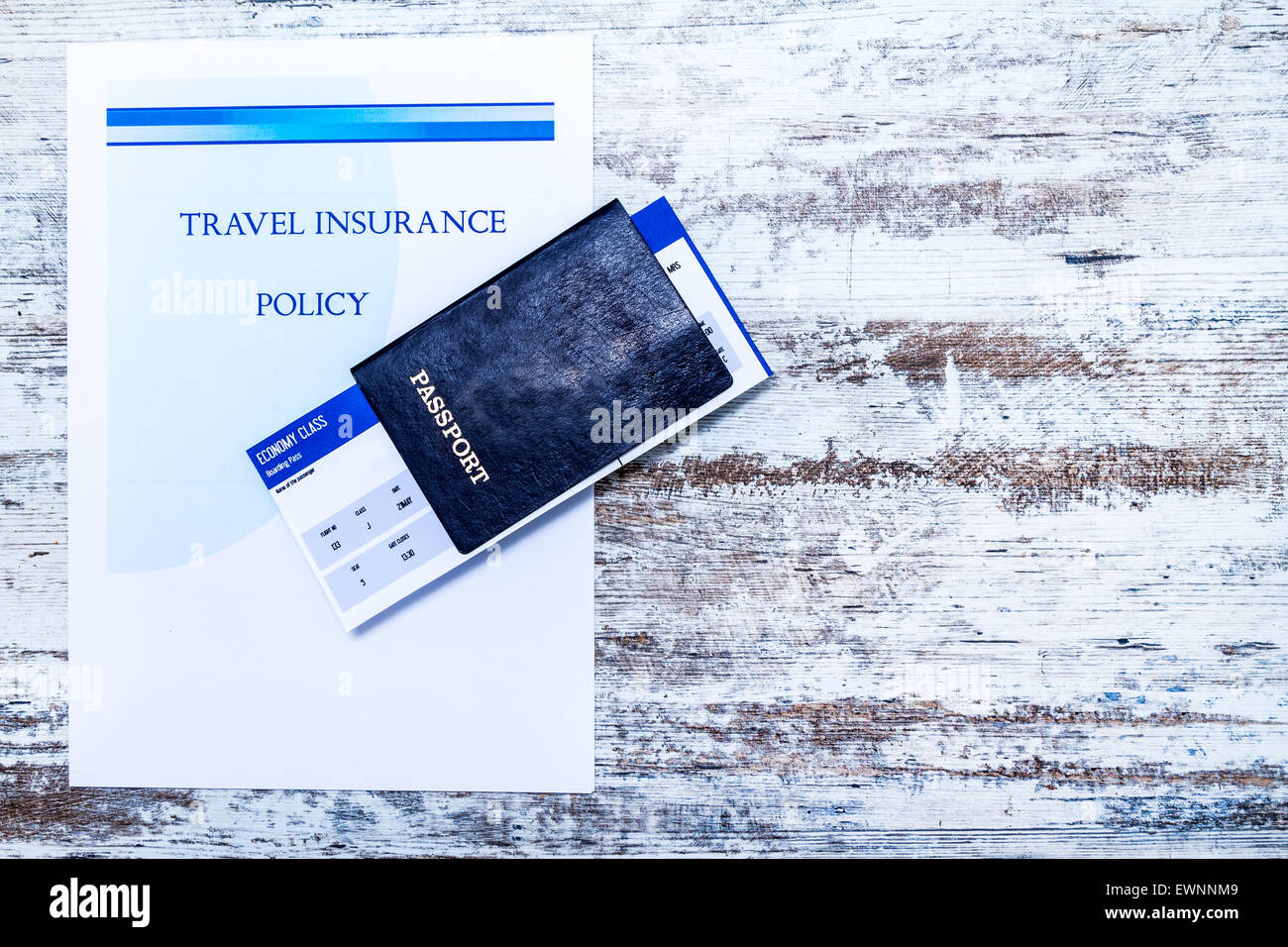 Travel insurance policy booklet with a boarding pass and a passport ...