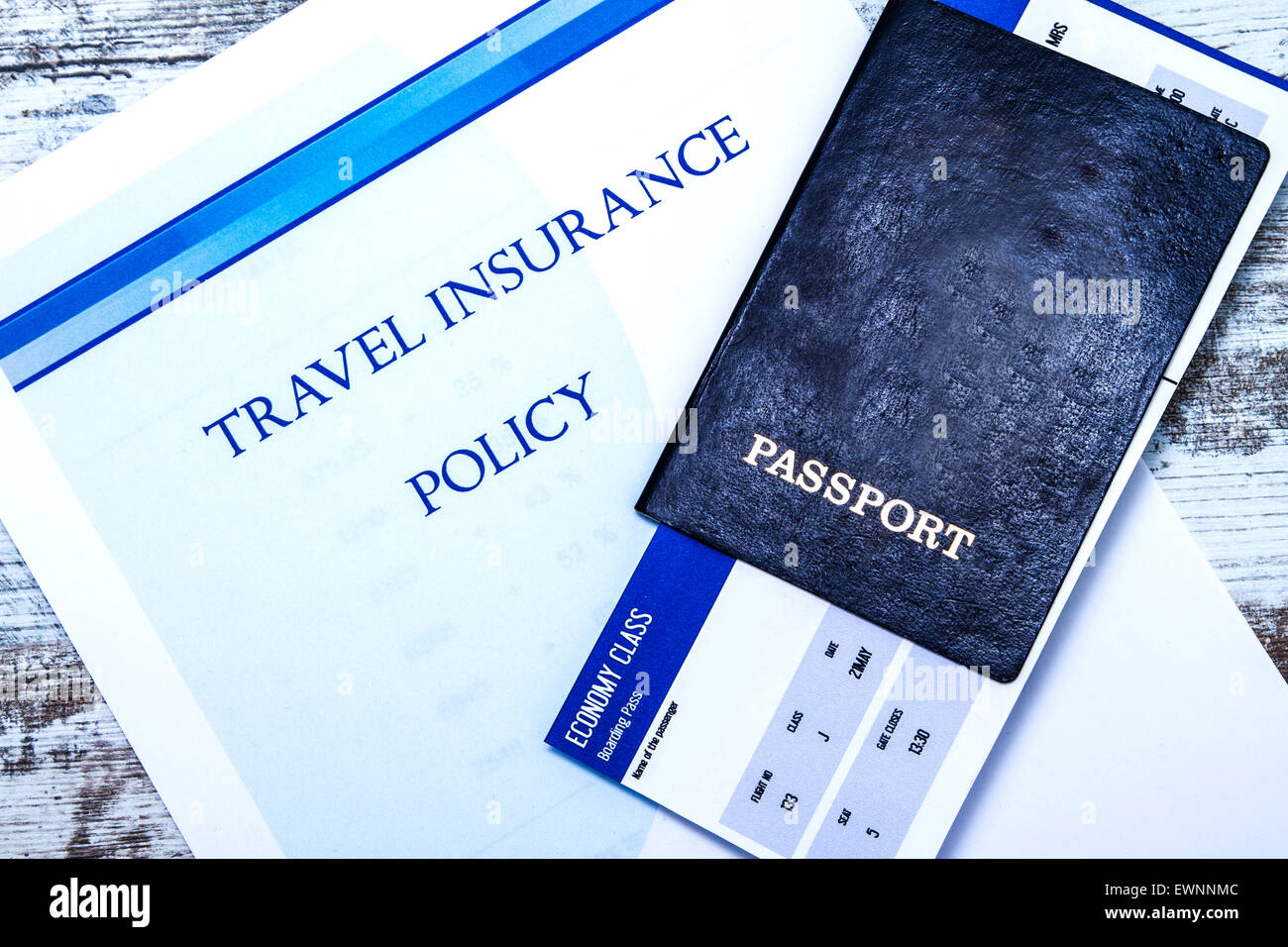 Travel insurance policy booklet with a boarding pass and a passport ...