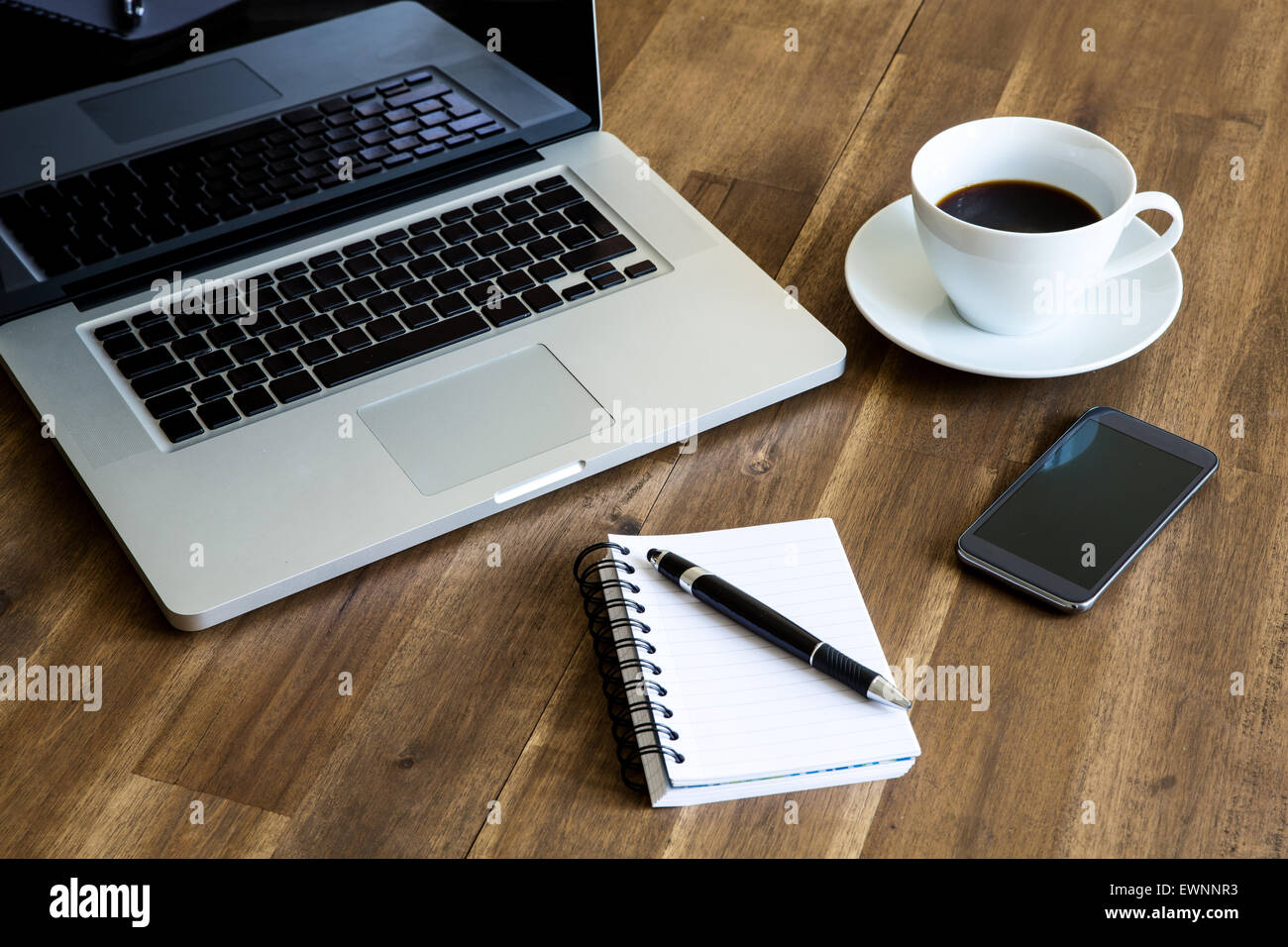 Working with the laptop, taking notes and drinking a coffee Stock Photo ...