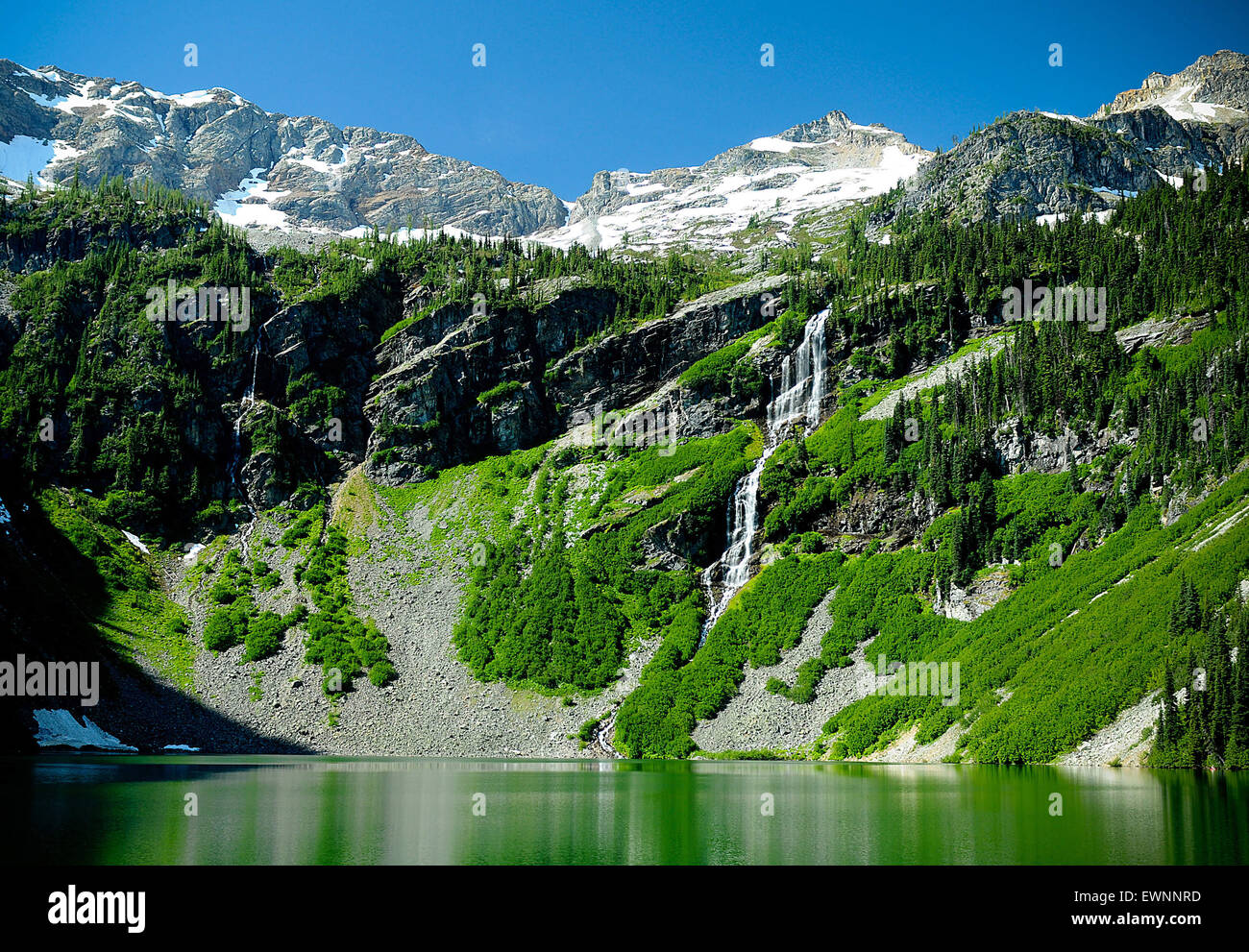 High alpine lake and waterfall in North Cascades National Park ...