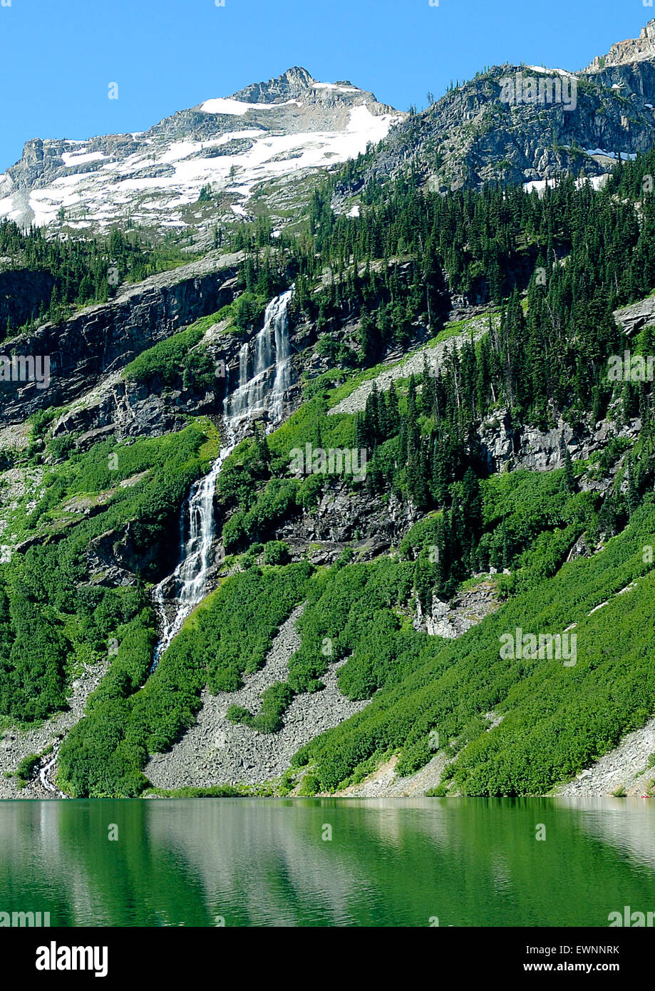 A cascading waterfall and high alpine lake in North Cascades National ...