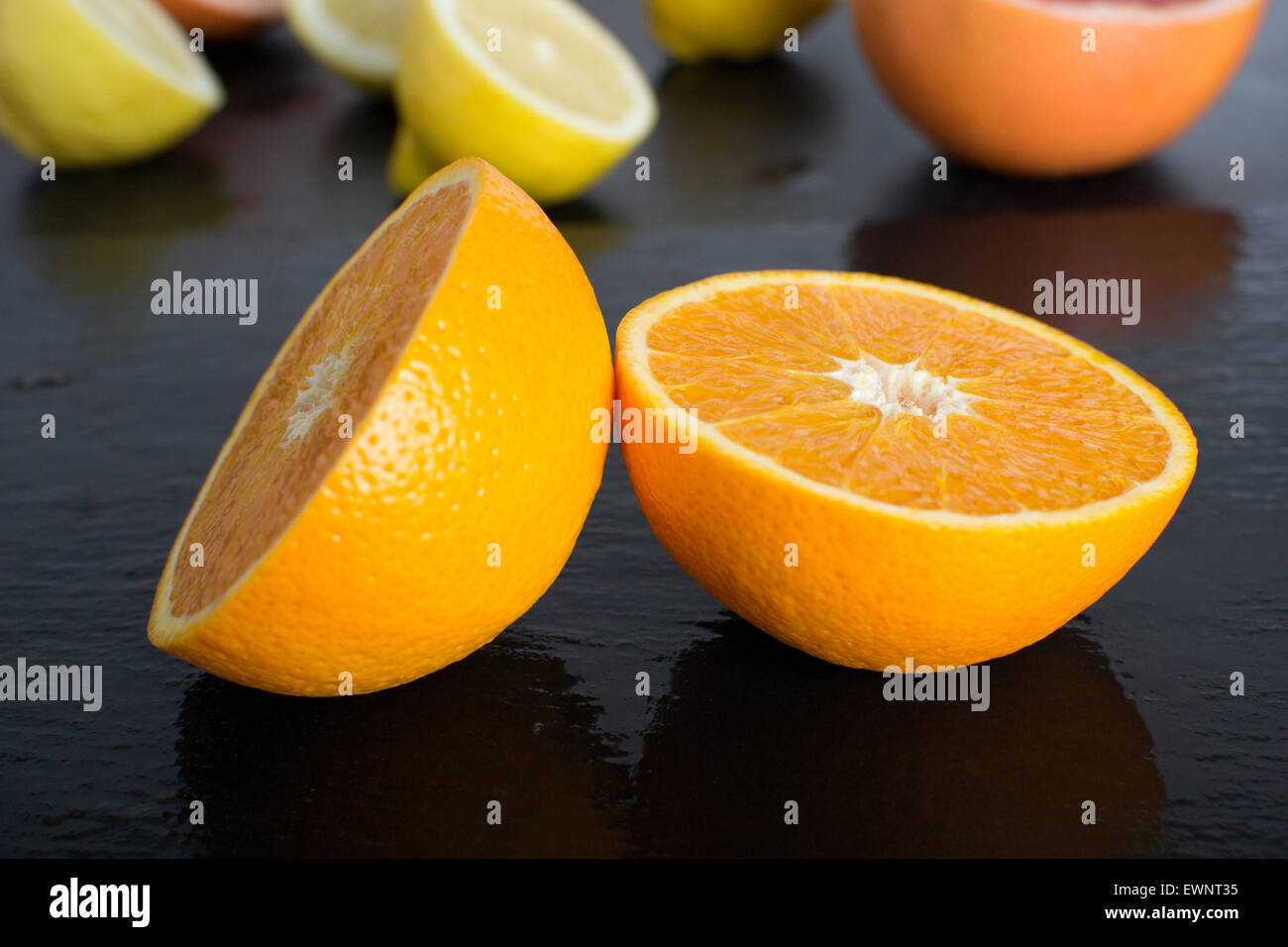 Sliced orange on slate Stock Photo - Alamy