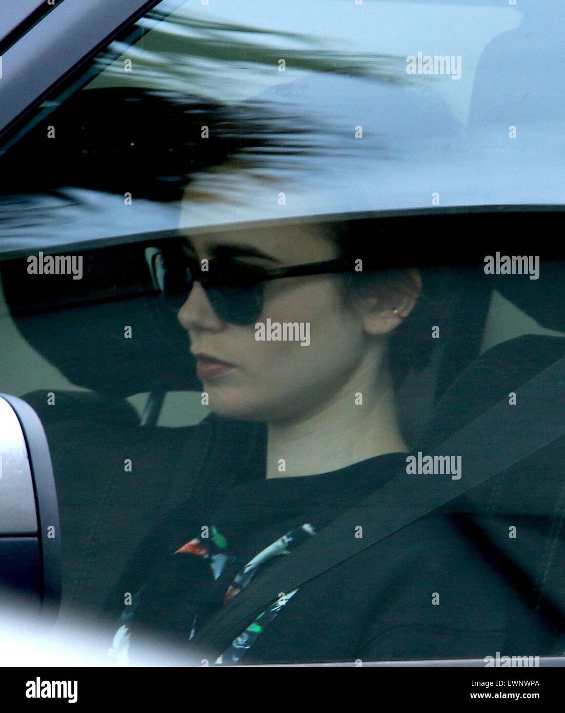 Lily Collins driving on Beverly Drive in Beverly Hills Featuring: Lily ...