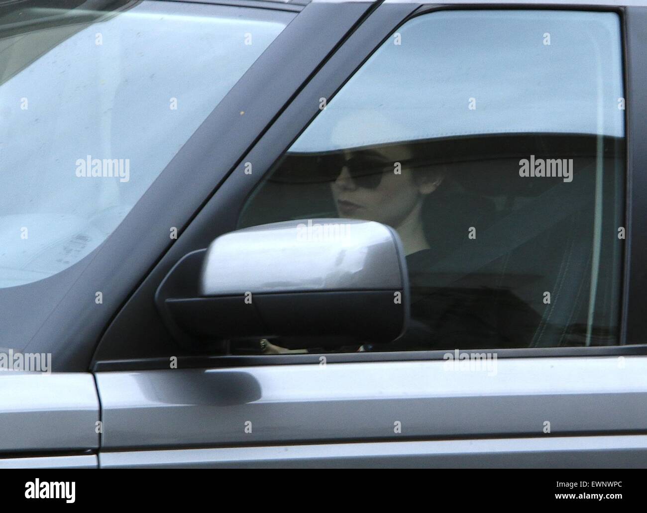 Lily Collins driving on Beverly Drive in Beverly Hills Featuring: Lily ...
