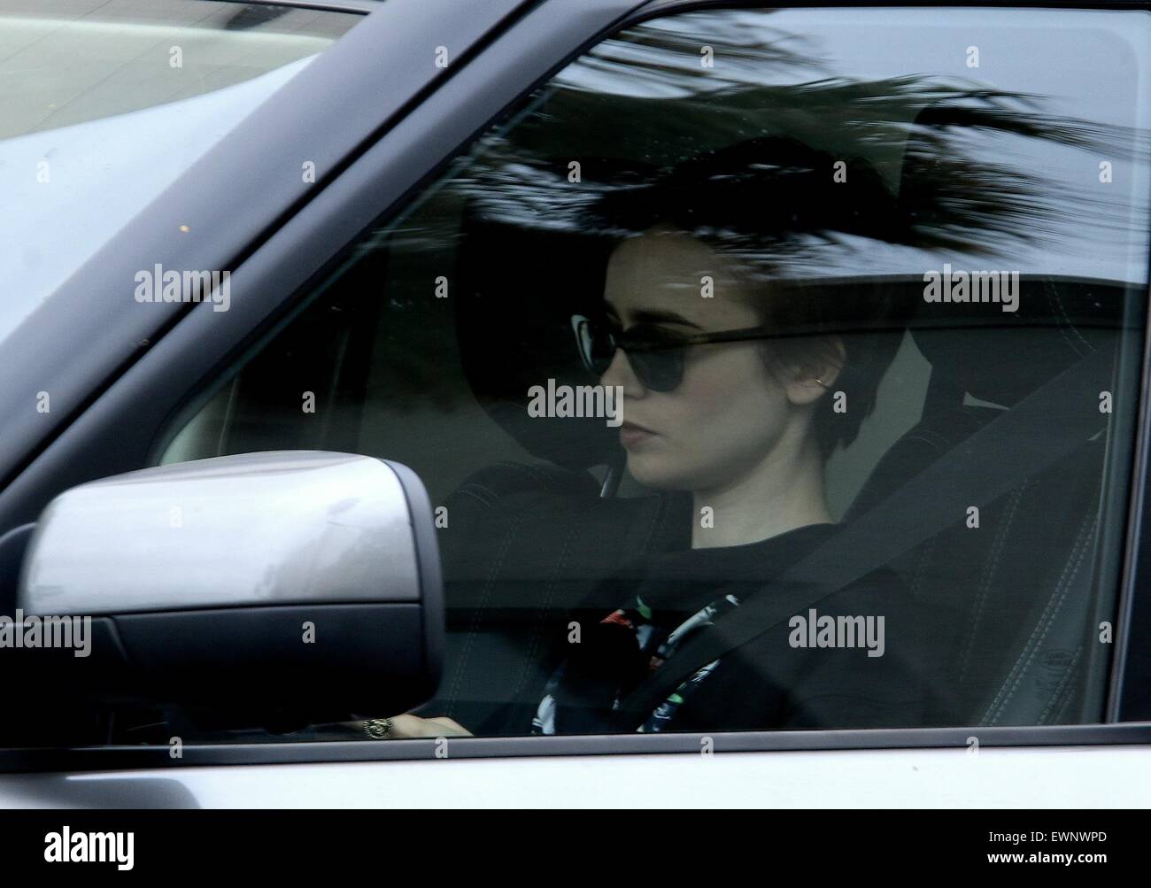 Lily Collins driving on Beverly Drive in Beverly Hills Featuring: Lily ...