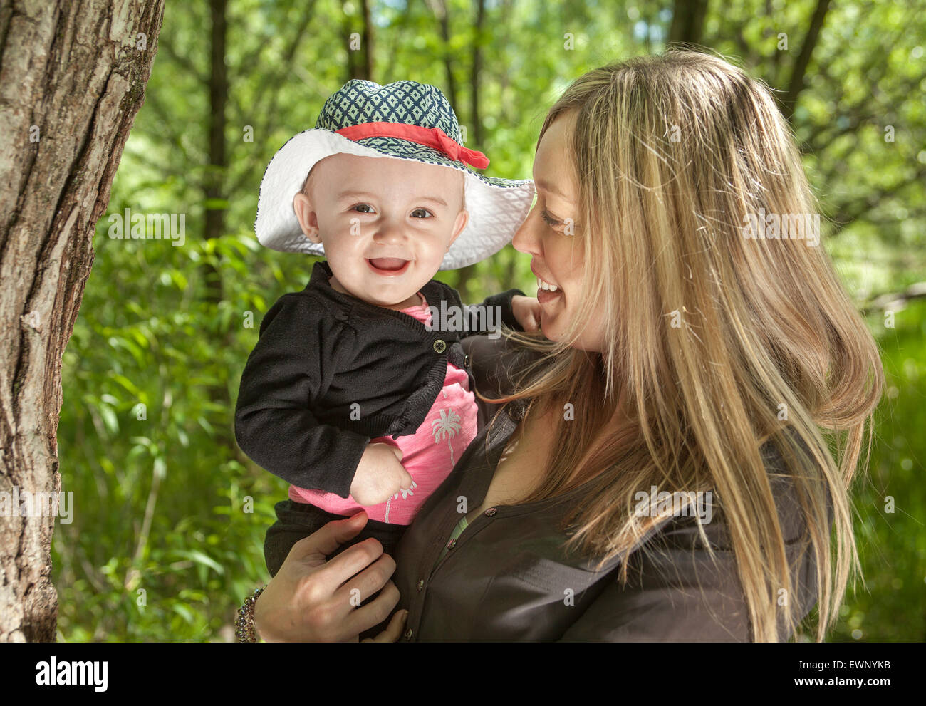 Mother and daughter in forest Stock Photo - Alamy