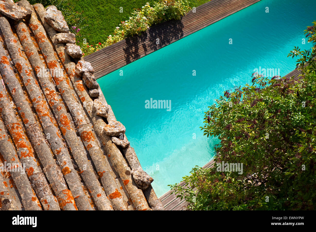 Swimming pool and old house in a garden Stock Photo - Alamy