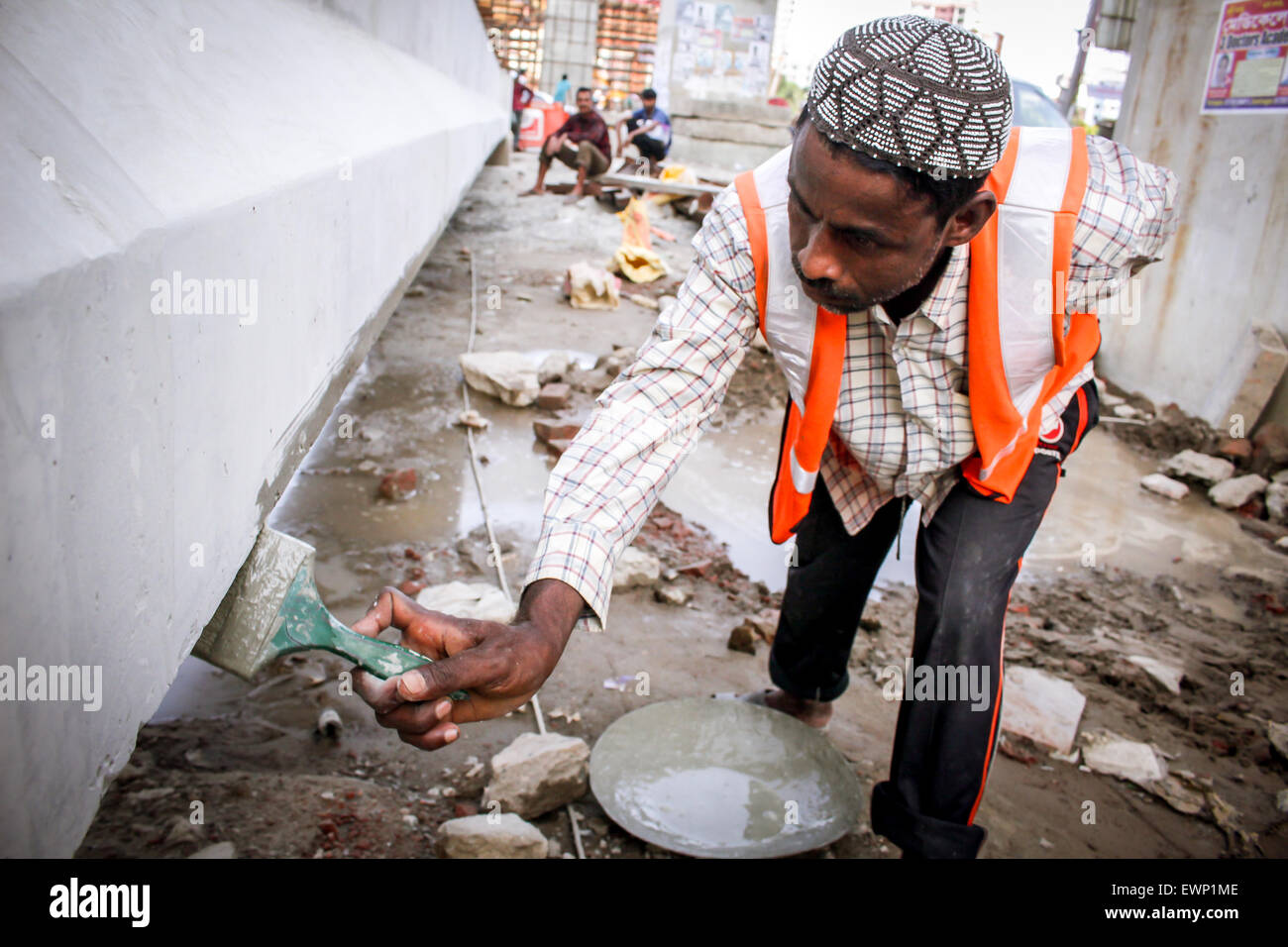 Dhaka, Bangladesh. 29th June, 2015. A construction worker working at ...