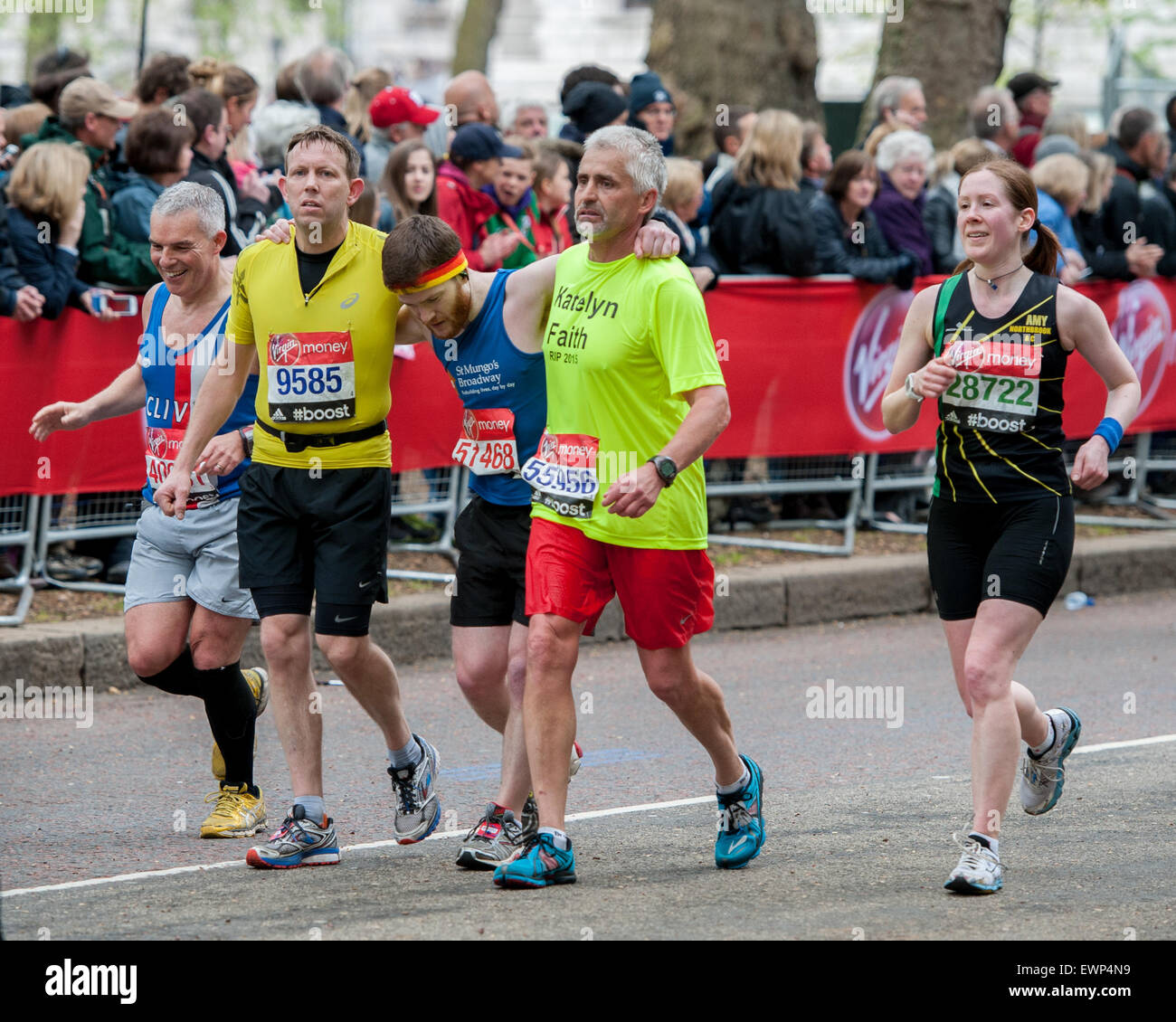 Runners in the London Marathon struggle in pain during the last ...