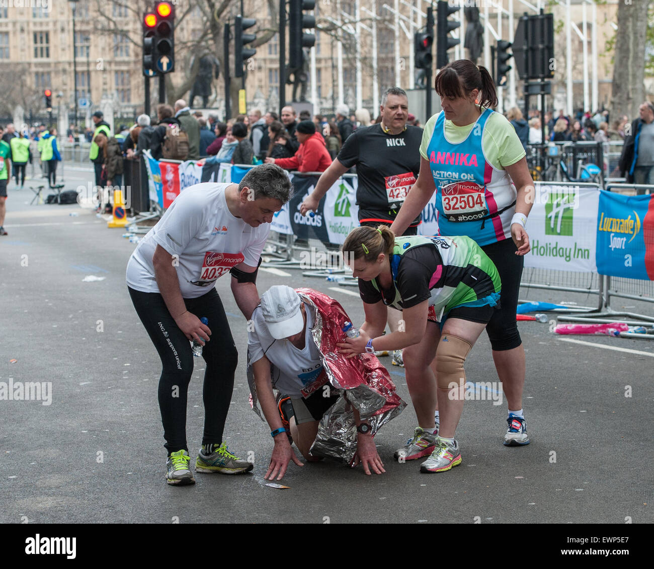 Runners in the London Marathon struggle in pain during the last ...