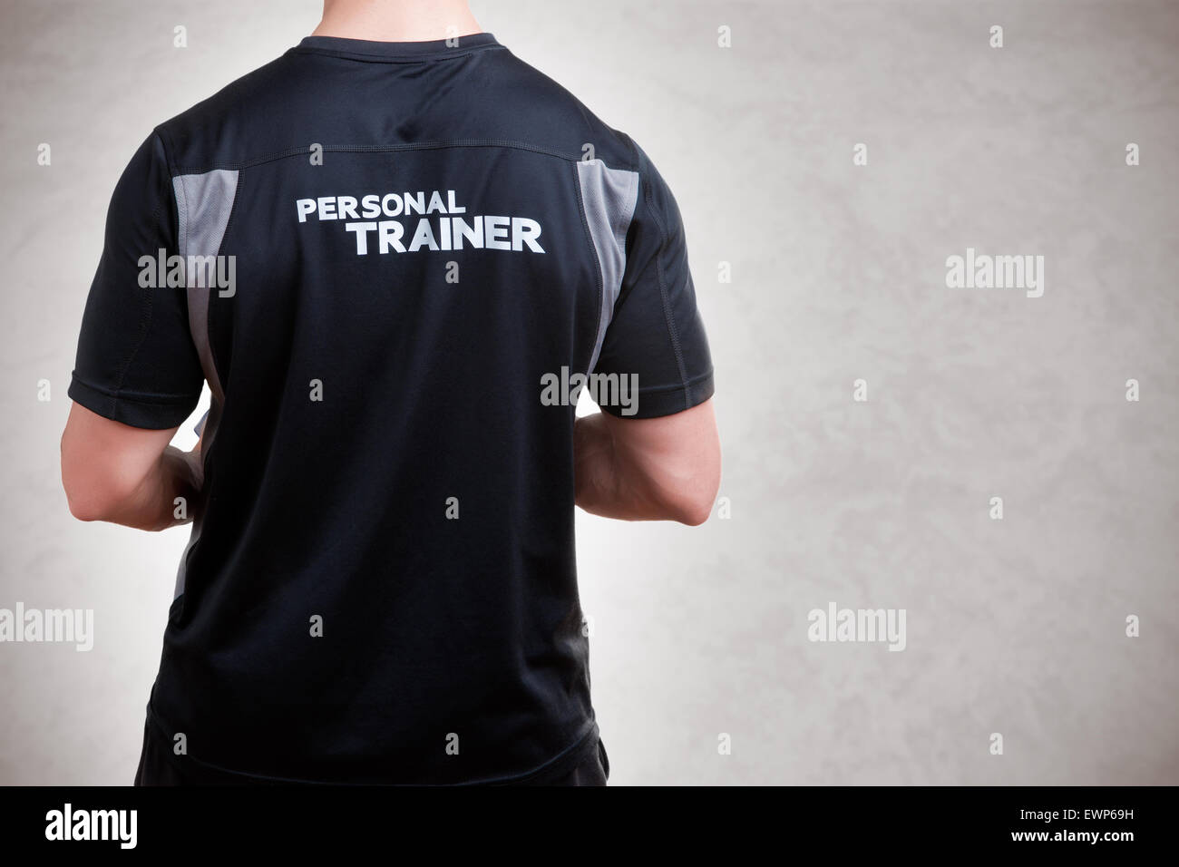 Back of a Personal Trainer isolated in grey Stock Photo - Alamy