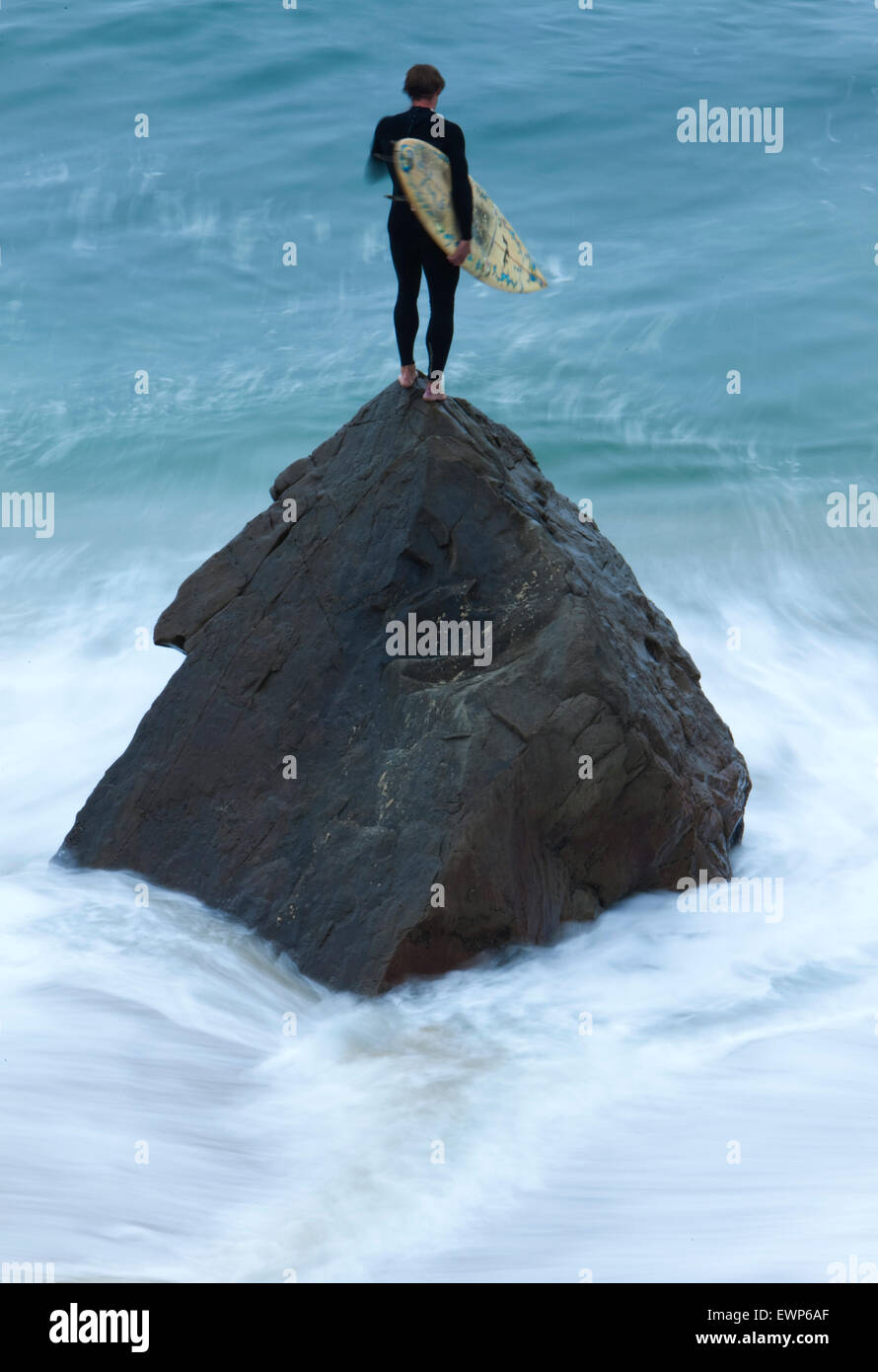 Surfer standing on a rock hi-res stock photography and images - Alamy