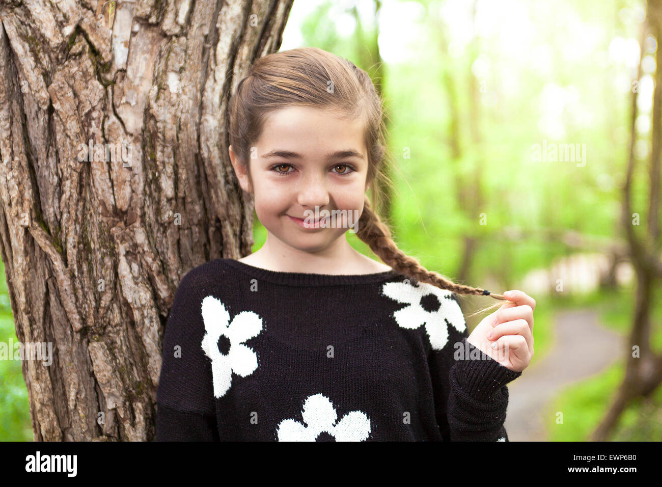 Adorable laughing child in forest Stock Photo - Alamy