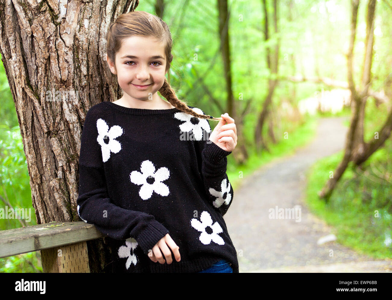 Adorable laughing child in forest Stock Photo - Alamy