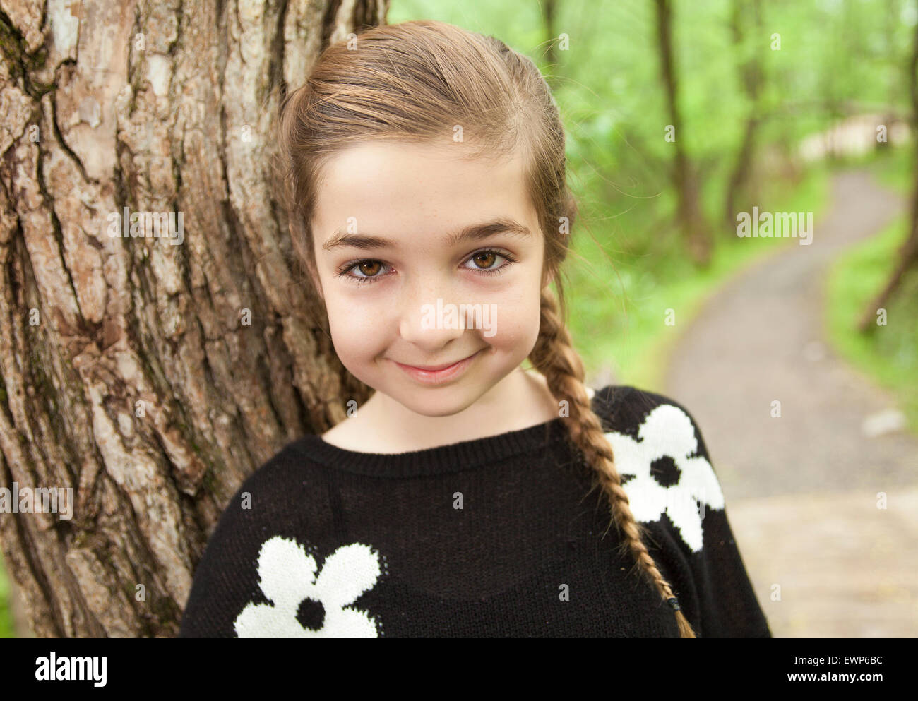 Adorable laughing child in forest Stock Photo - Alamy