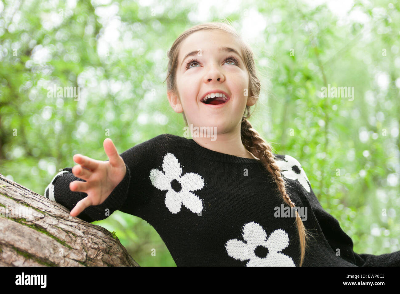 Adorable laughing child in forest Stock Photo - Alamy