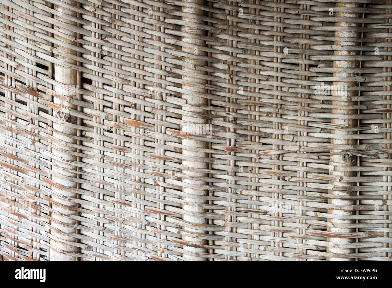 Textured woven rattan wood wicker background with structural supports ...