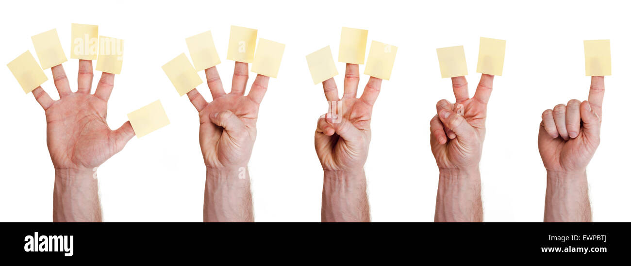 five hands holding post it on finger Stock Photo - Alamy