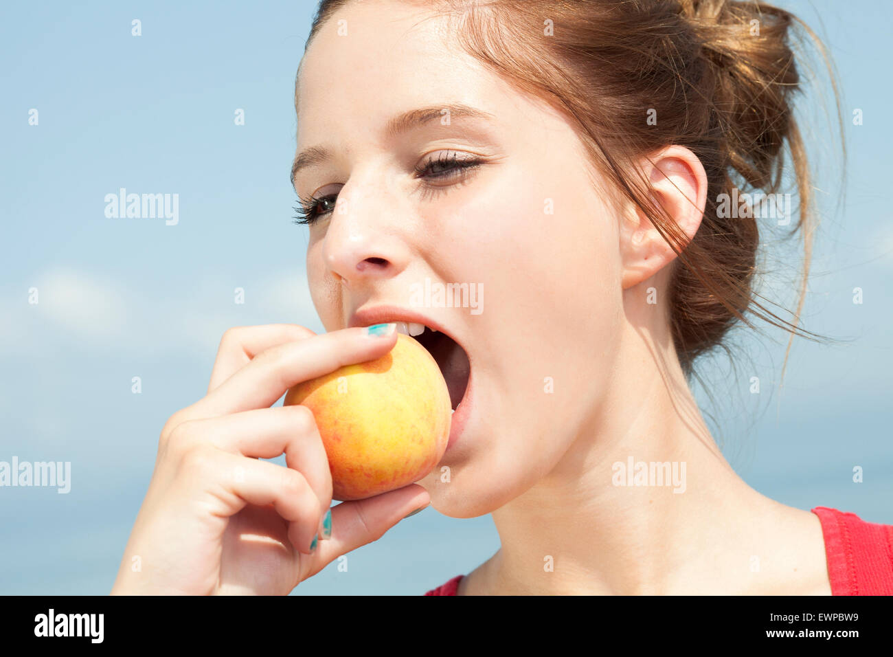 Girl Eat Peach Stock Photo - Alamy