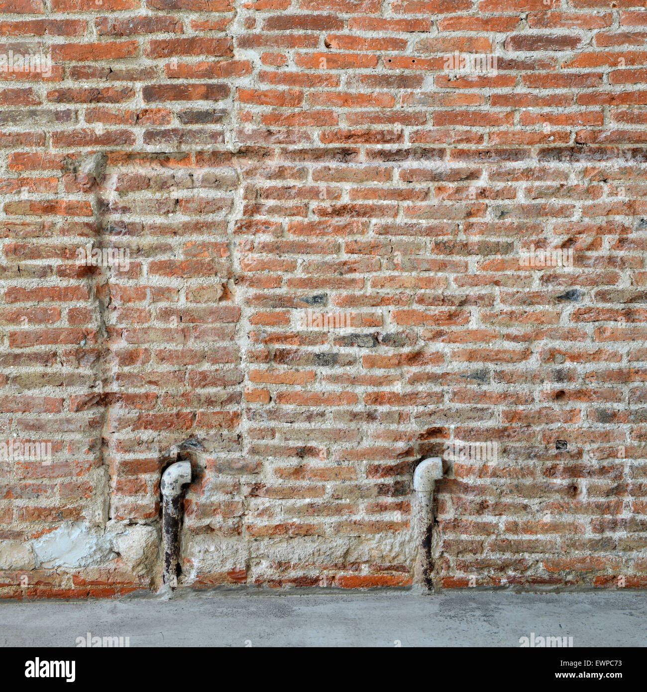 Old brick wall and pipe on concrete texture, background for decorate ...