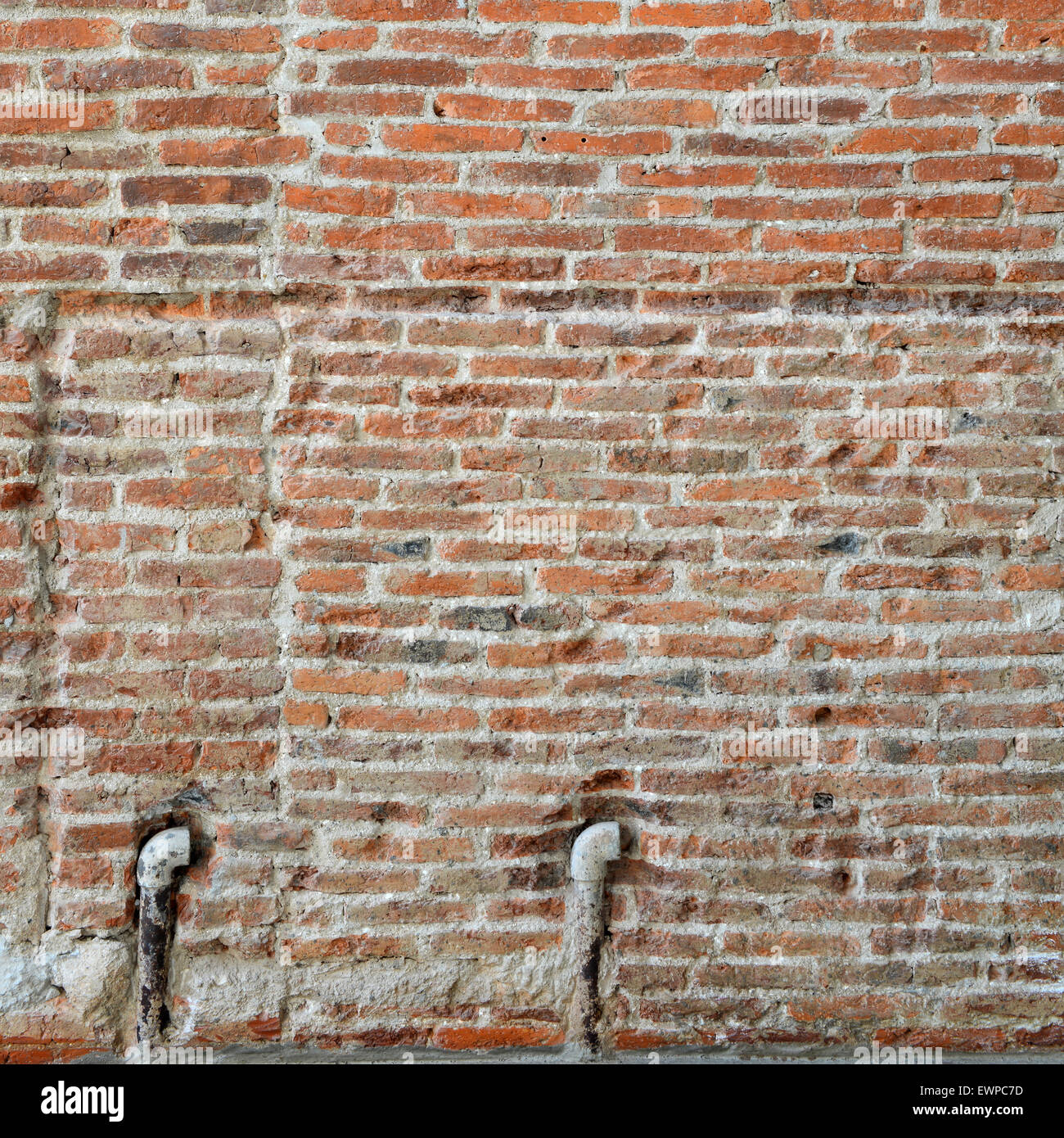 Old brick wall and pipe on concrete texture, background for decorate ...