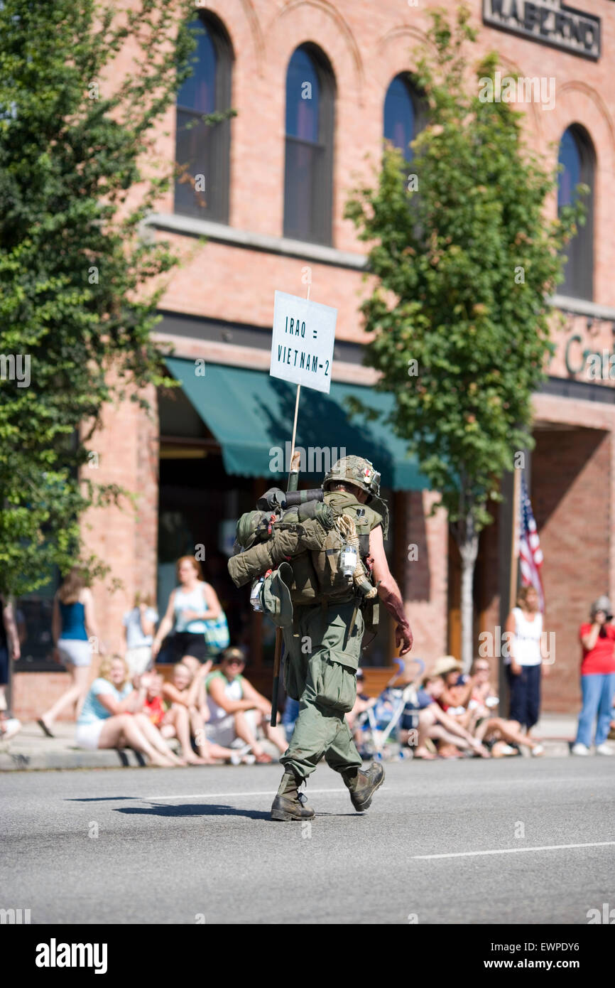 Soldier walking alone in a 4th of July parade Stock Photo - Alamy
