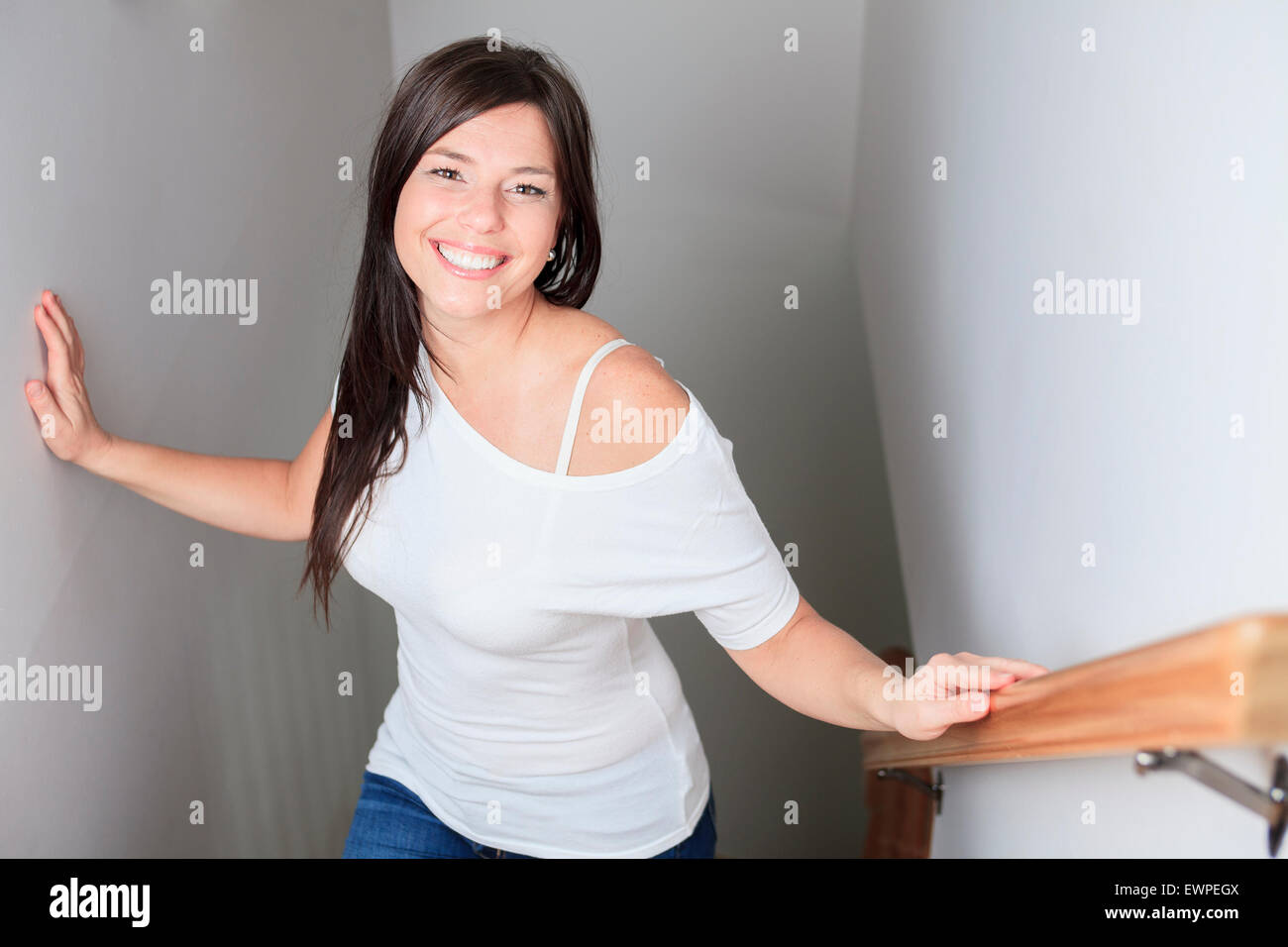 Woman walking upstairs house hi-res stock photography and images - Alamy