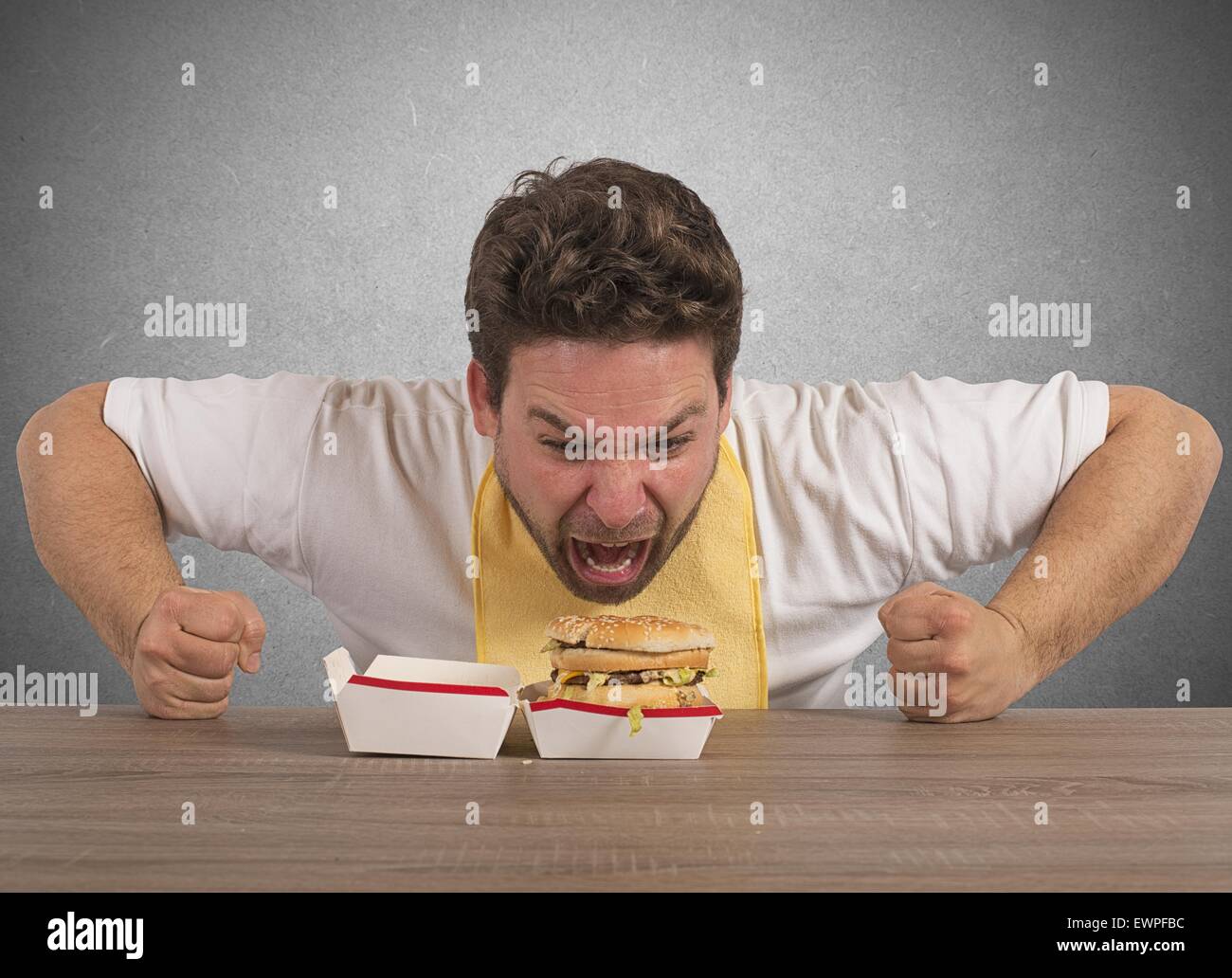 Hungry fat man Stock Photo - Alamy