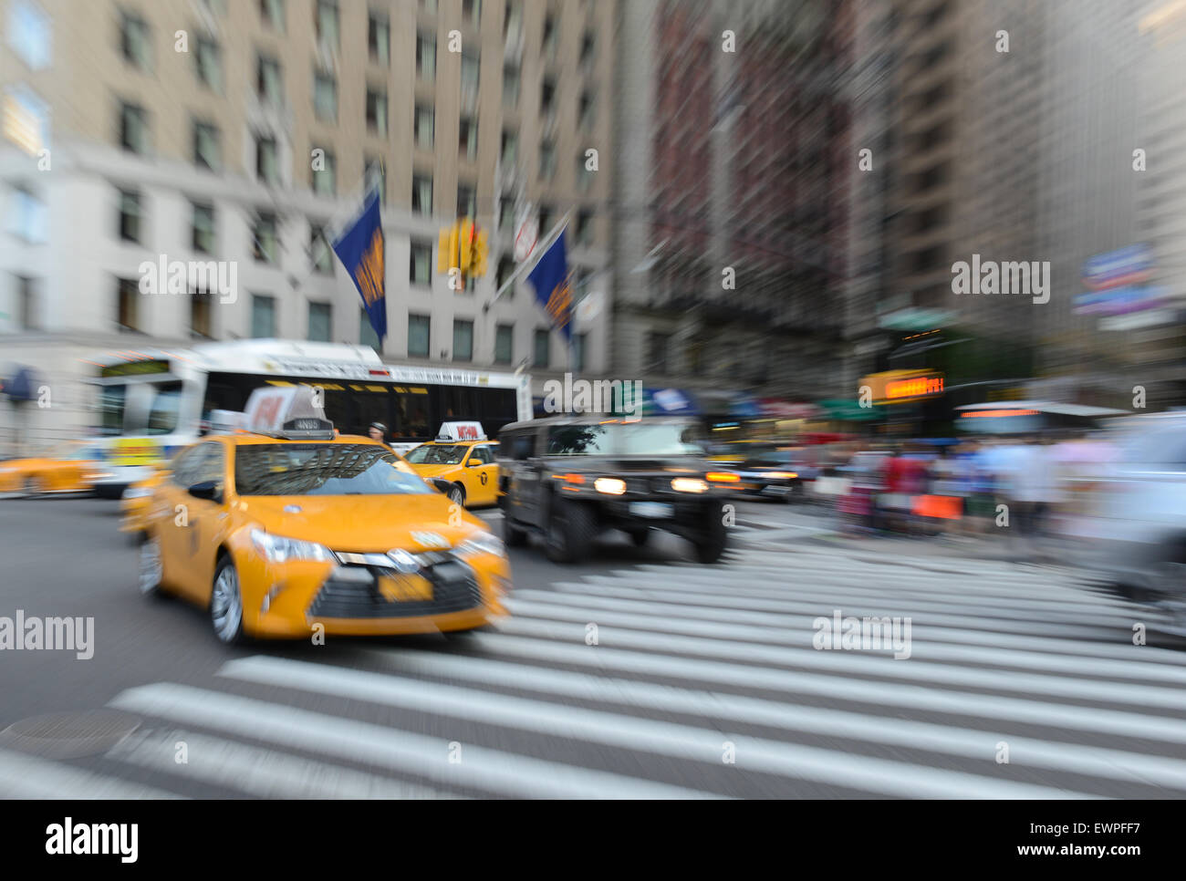 Purposely Blurred taxi cabs and vehicles in traffic showing fast motion ...