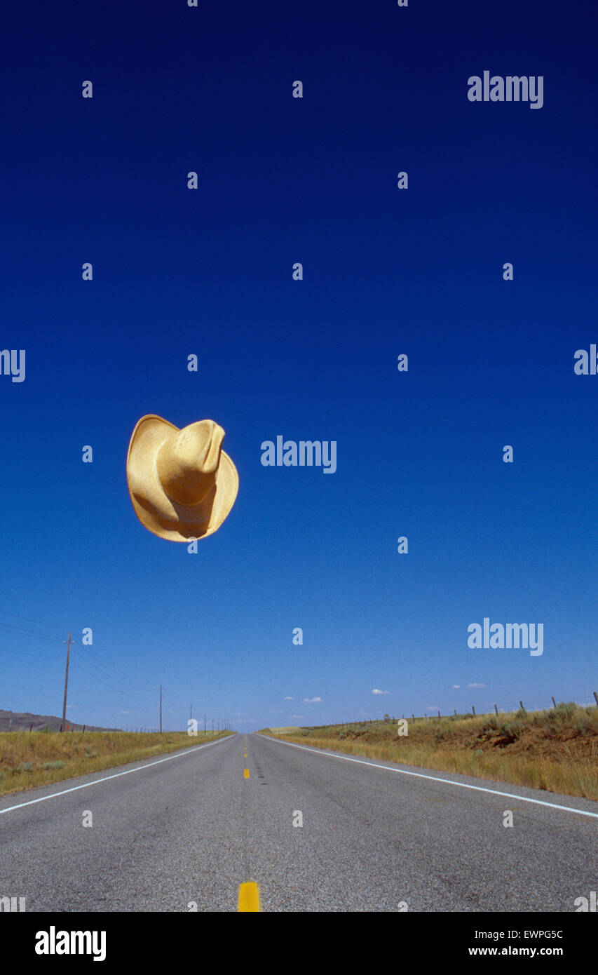 Cowboy hat floating through the air over a remote highway in Idaho ...