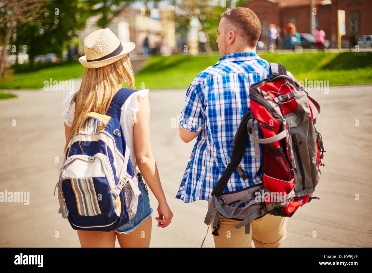Young man and woman in casualwear traveling in foreign city Stock Photo ...