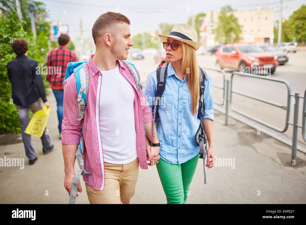 Affectionate couple taking walk in city Stock Photo - Alamy