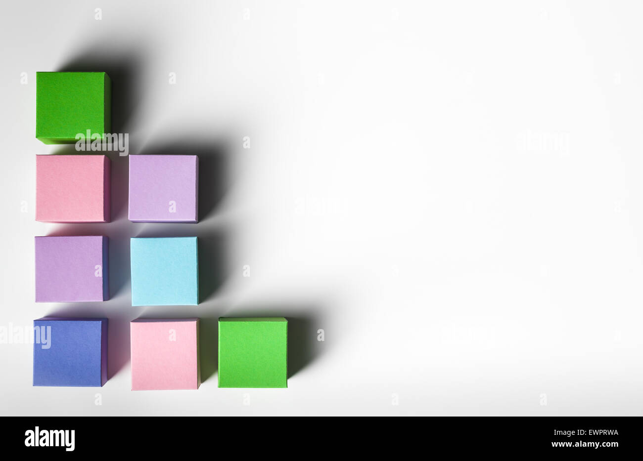 empty colorful paper cubes in a row on white background. copy space ...
