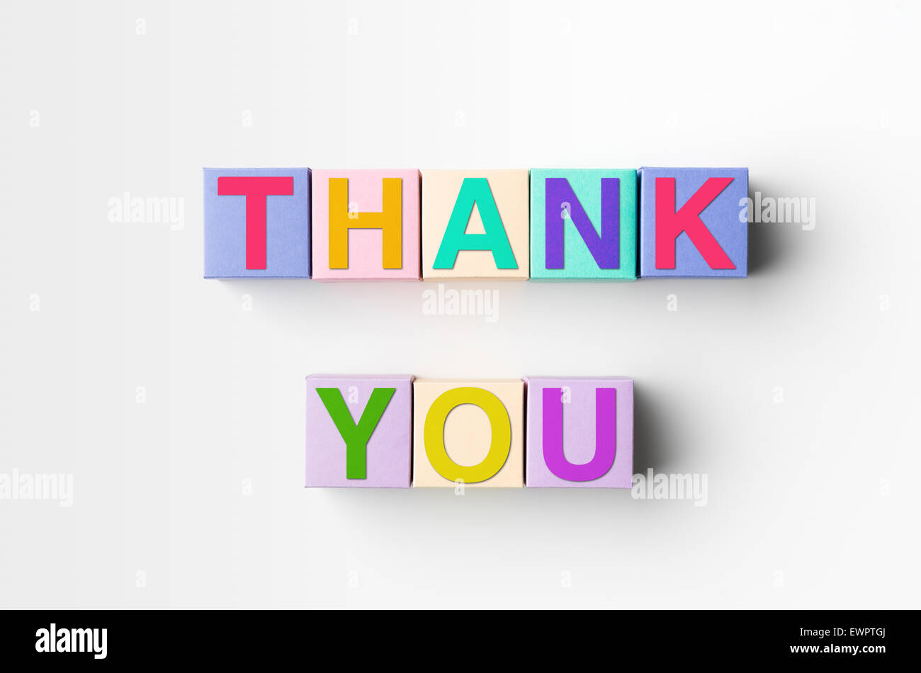 multicolored blocks with thank you written on them, on white background ...
