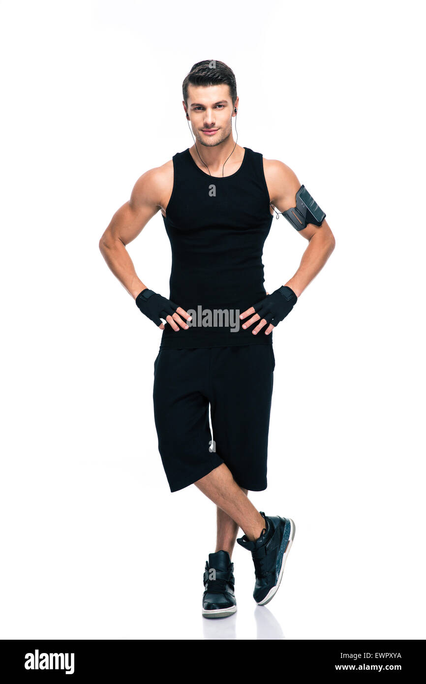 Full length portrait of a confident fitness man standing isolated on a ...