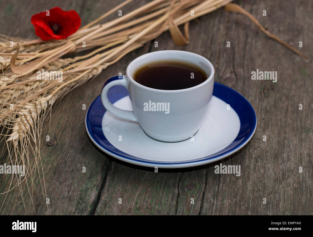 black coffee, wheat and flower of red poppy Stock Photo - Alamy