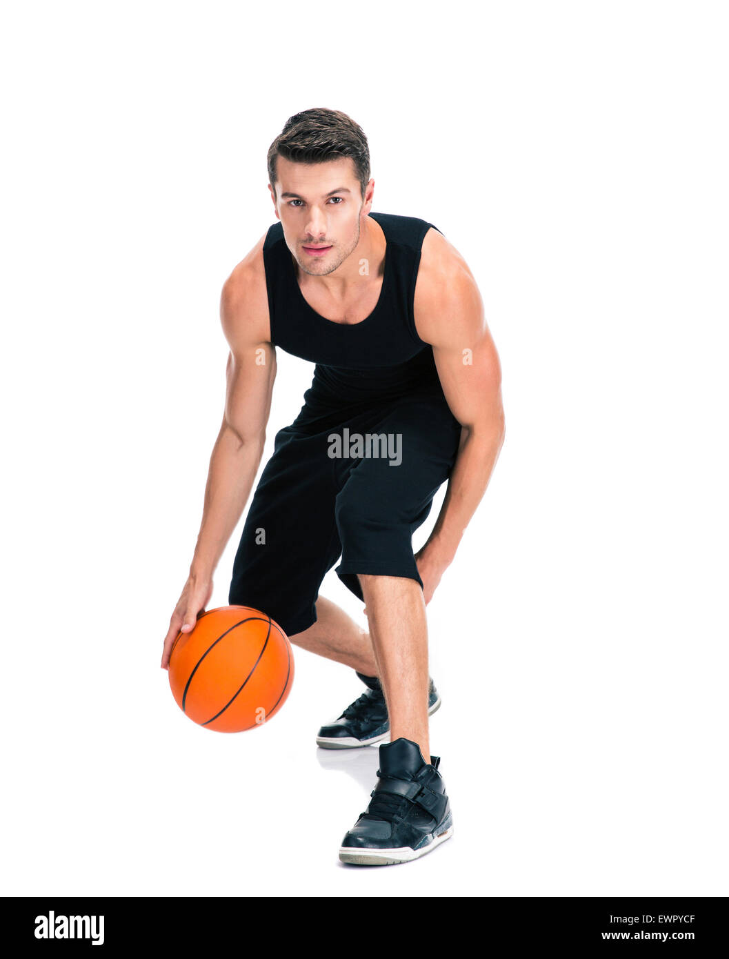 Full length portrait of a handsome man playing in basketball isolated ...