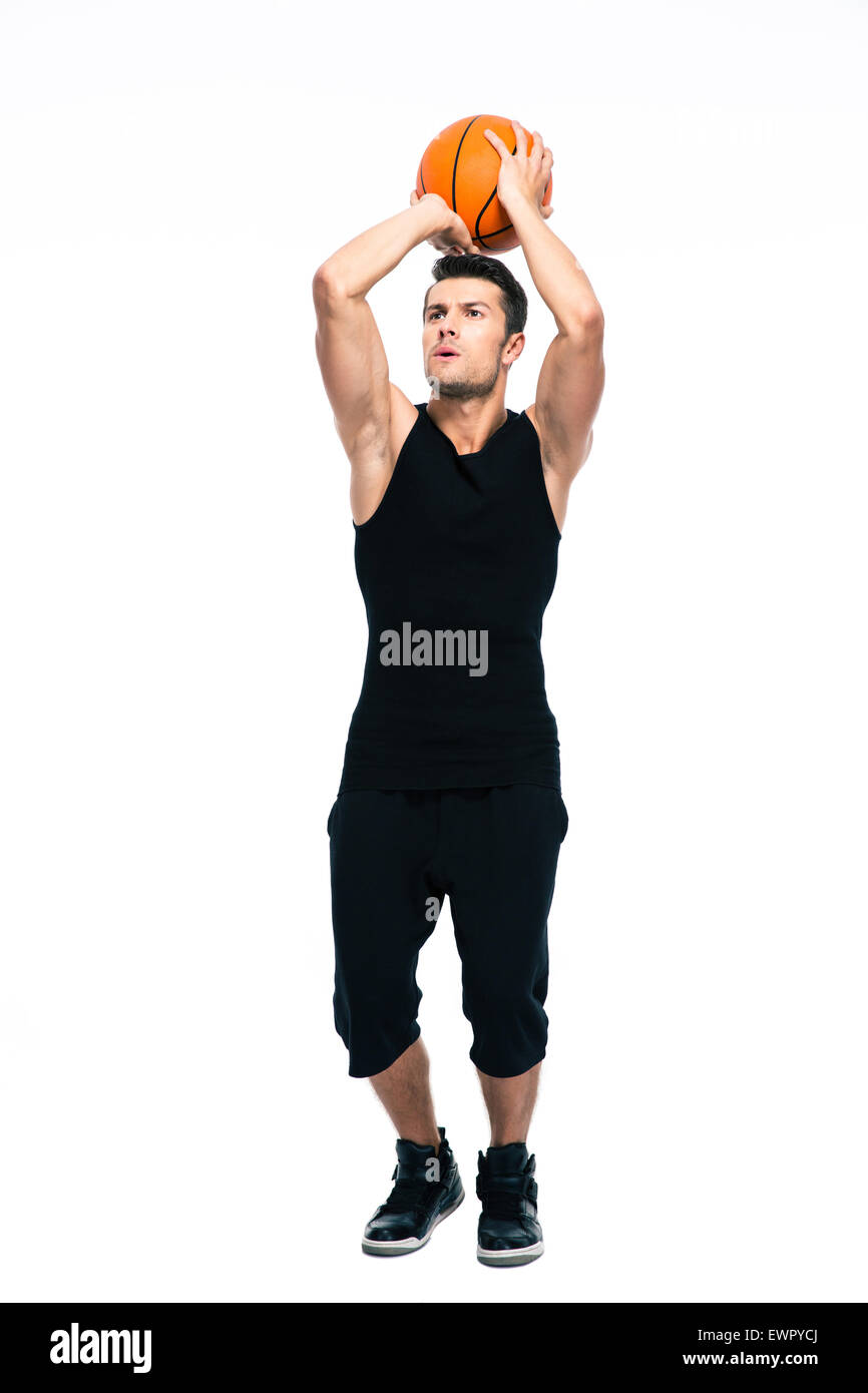 Portrait of a sports man playing in basketball isolated on a white ...