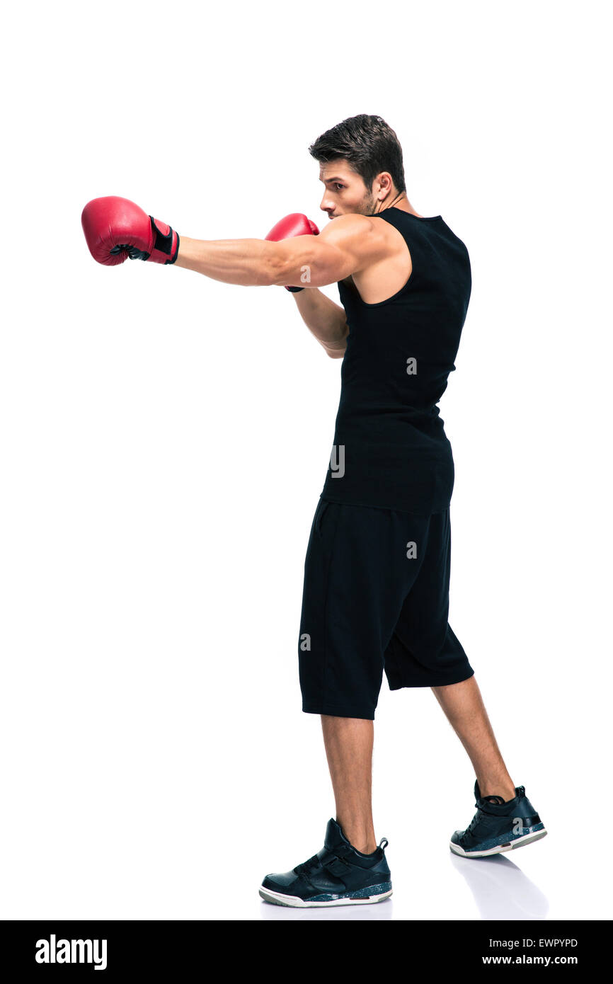 Full length portrait of a sports man boxing in red gloves isolated on a ...