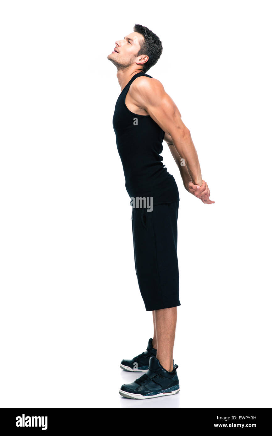Side view portrait of a fitness man stretching hands isolated on a ...