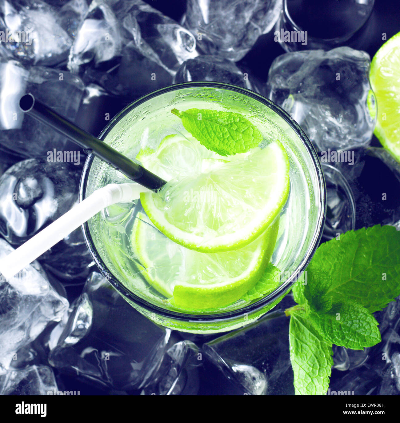 cold Mojito cocktail with fresh lime, mint and ice. view from above ...