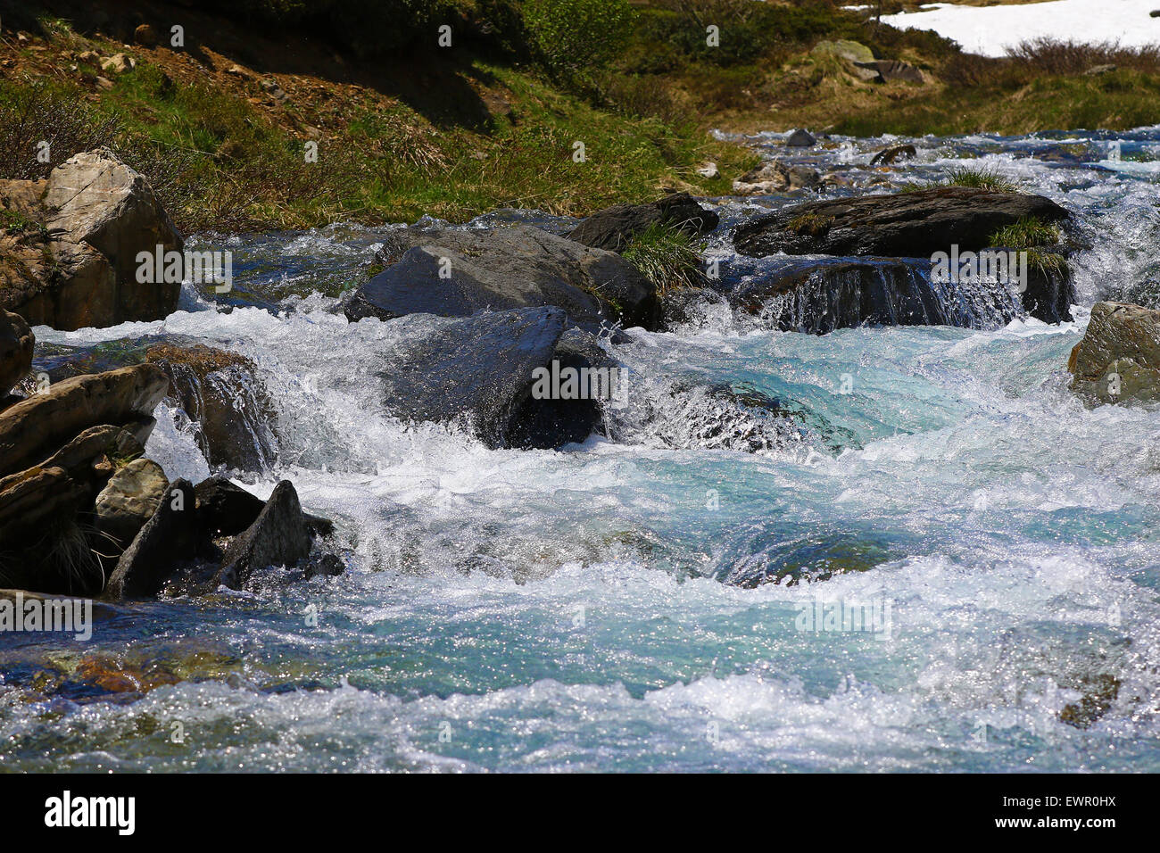 Clear mountain water running from a glacier Stock Photo - Alamy